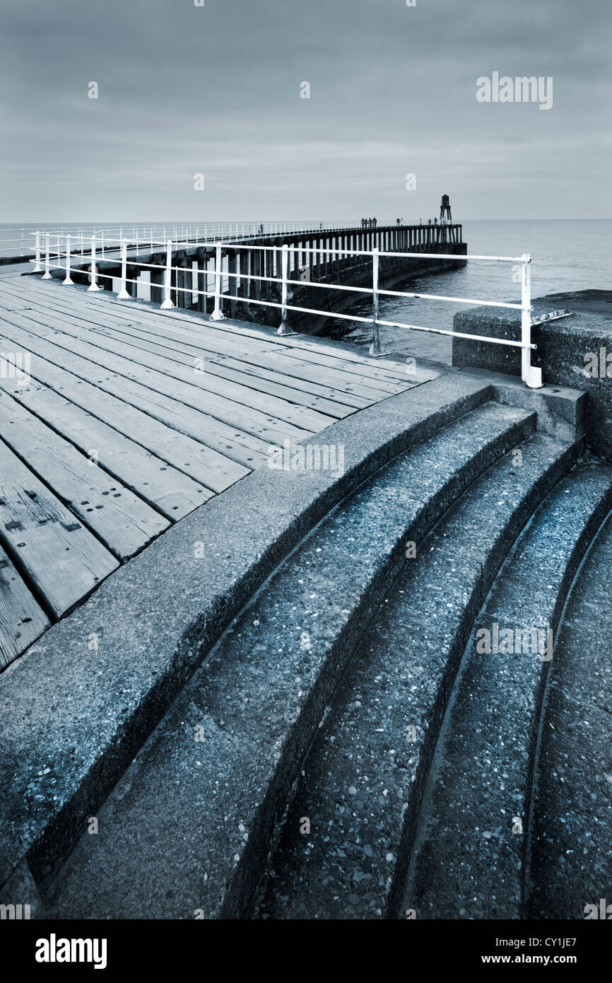 Jetty into the north sea at Whitby, North Yorkshire, England Stock ...