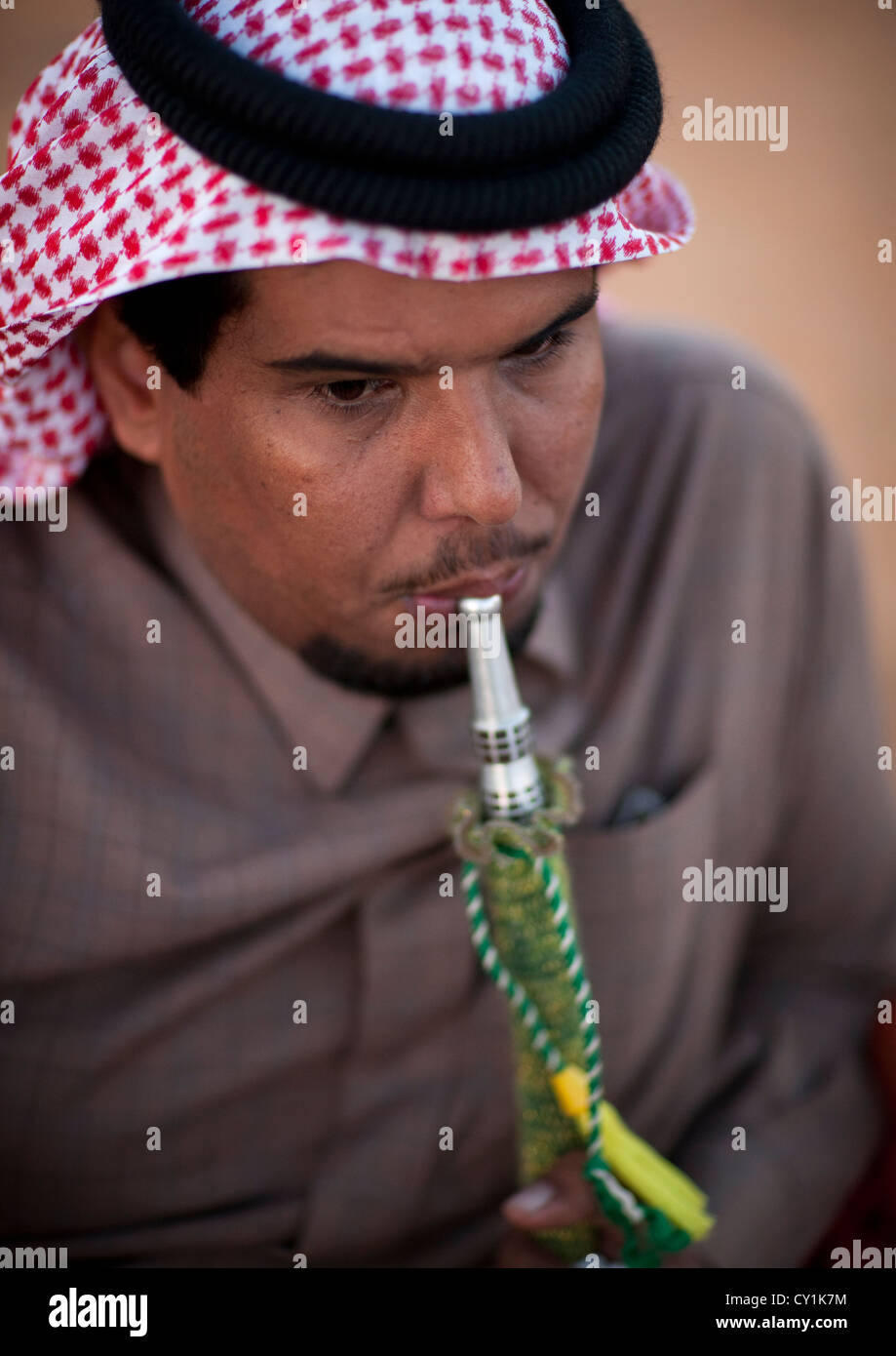 Beduin Smoking In Sakakah Desert, Saudi Arabia Stock Photo - Alamy