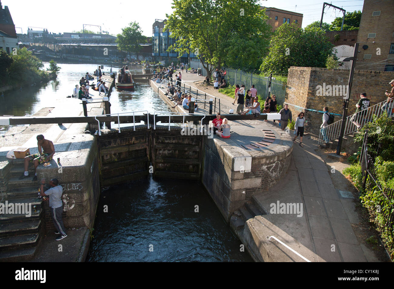 England. London. Camden Lock. People and Regent's Canal lock gates ...
