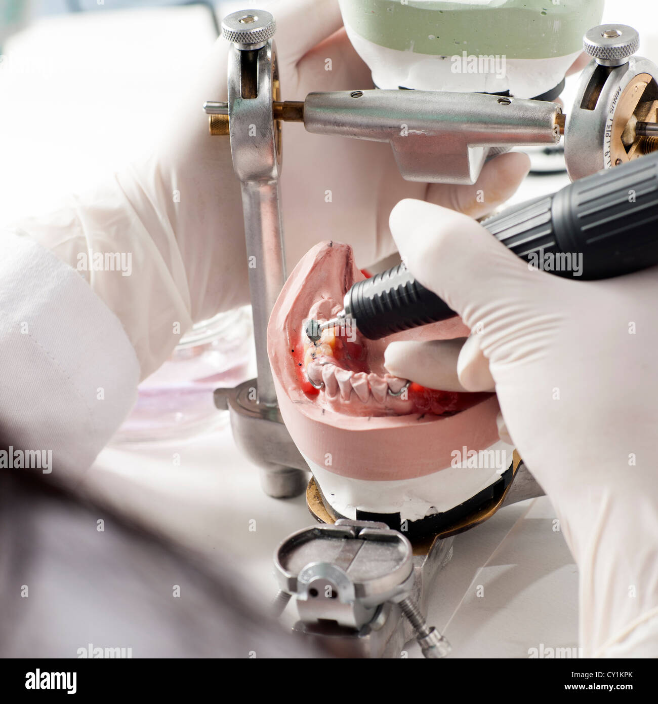 Dental technician working with articulator in dental laboratory Stock ...