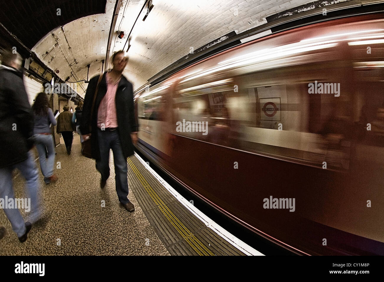 A man gets out of a train in a London Underground Station Stock Photo ...