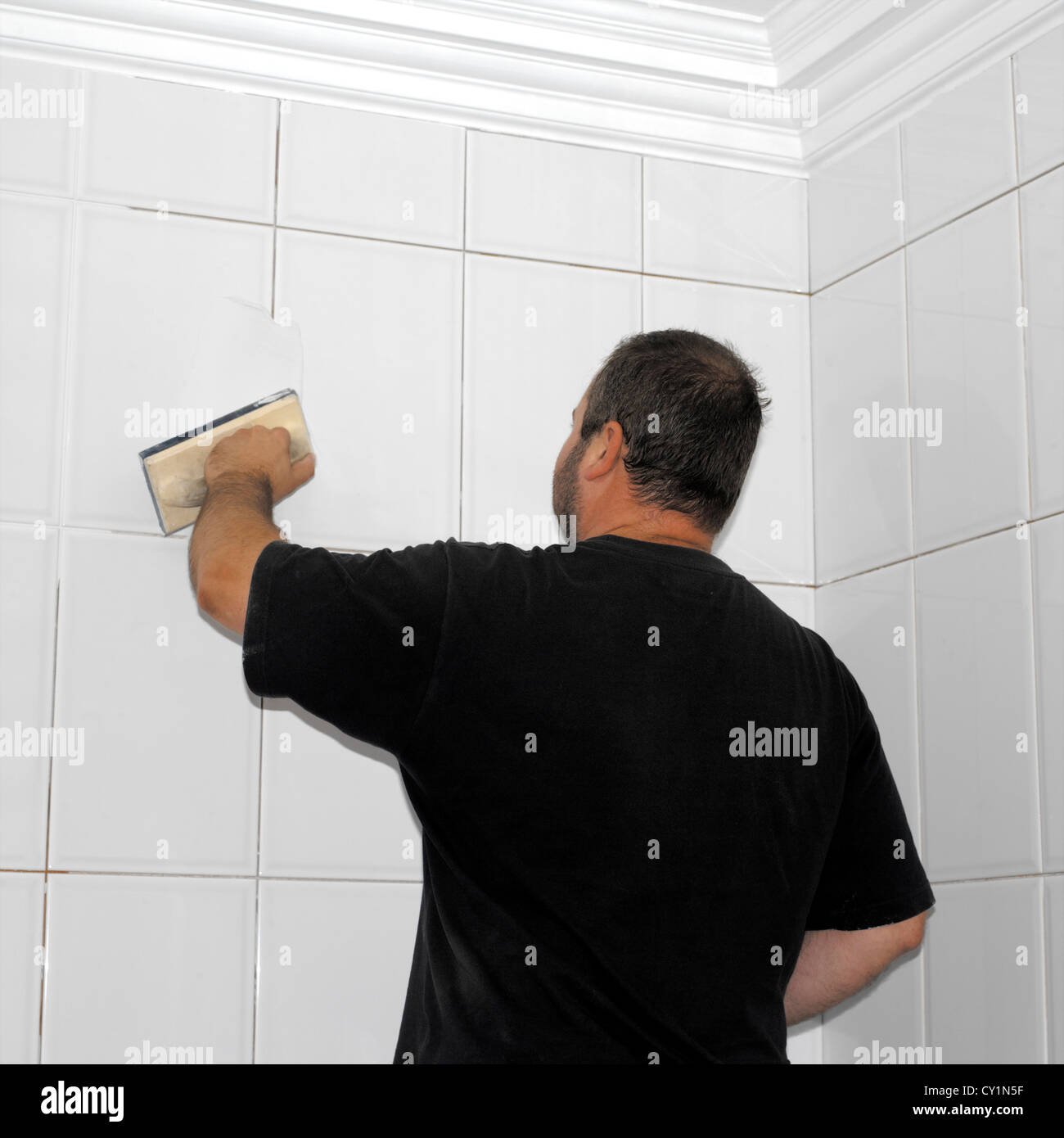 Grouting Tiles in New Bathroom Stock Photo - Alamy