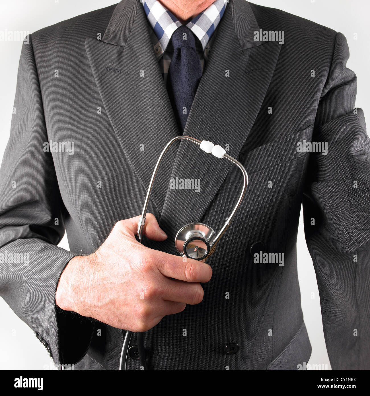 Medical consultant wearing smart suit holding stethoscope Stock Photo ...
