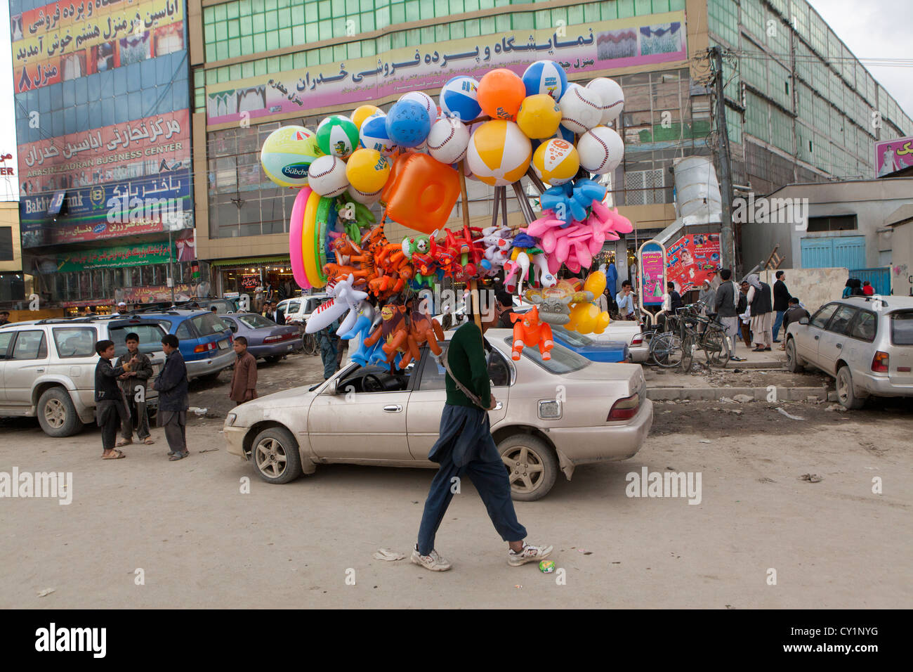 street vendor selling plastic toys Stock Photo - Alamy
