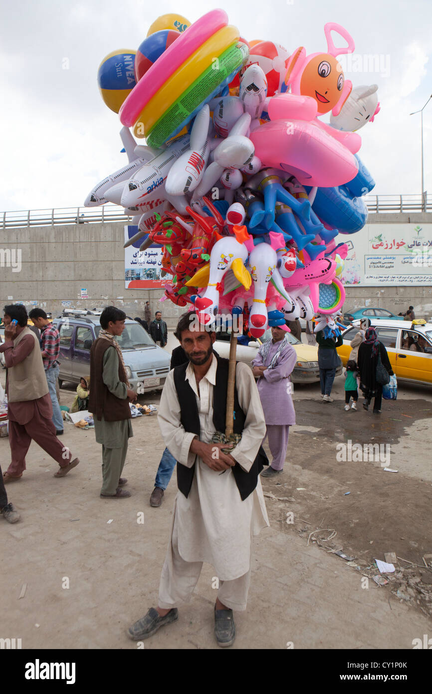 street vendor selling plastic toys Stock Photo - Alamy
