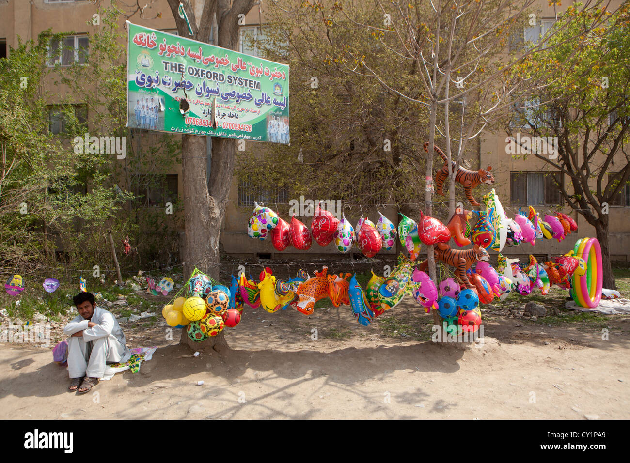 street vendor selling plastic toys Stock Photo - Alamy