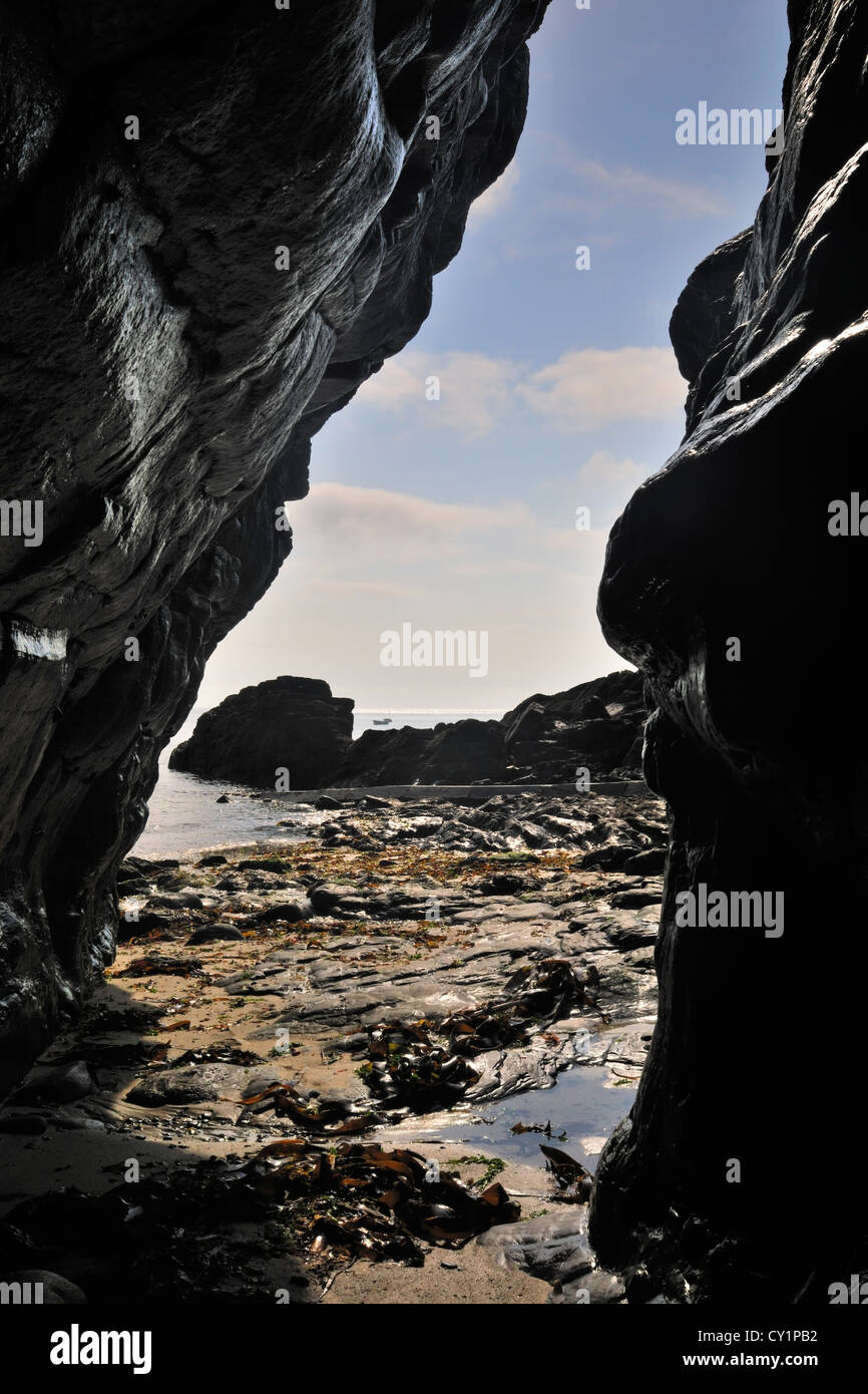 Sculptured rocks at the entrance to a cave at Church Cove, Lizard ...