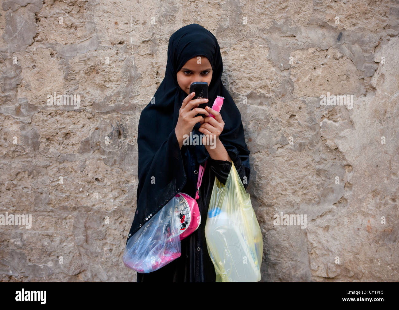 Saudi Girl Taking Picture With Mobile Phone, Saudi Arabia Stock Photo ...