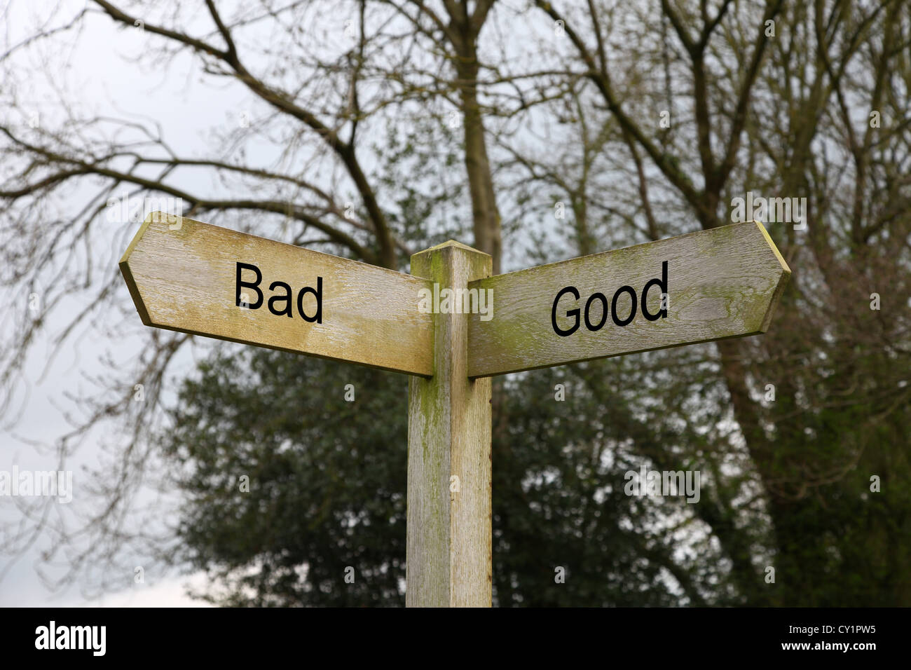 A wooden signpost showing Bad and Good Stock Photo - Alamy