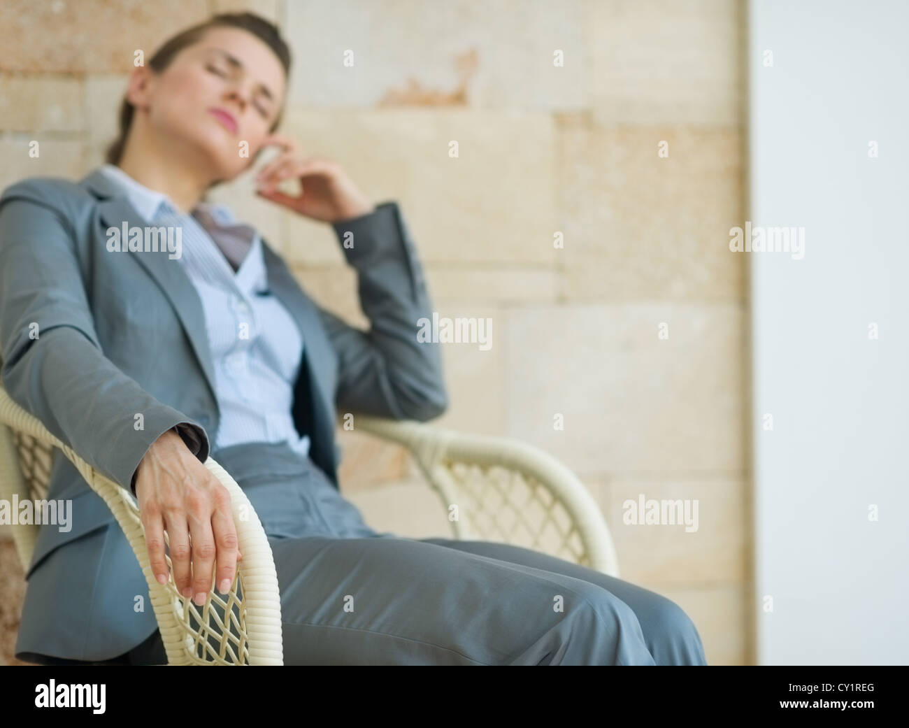 Closeup on tired business woman relaxing on chair Stock Photo - Alamy