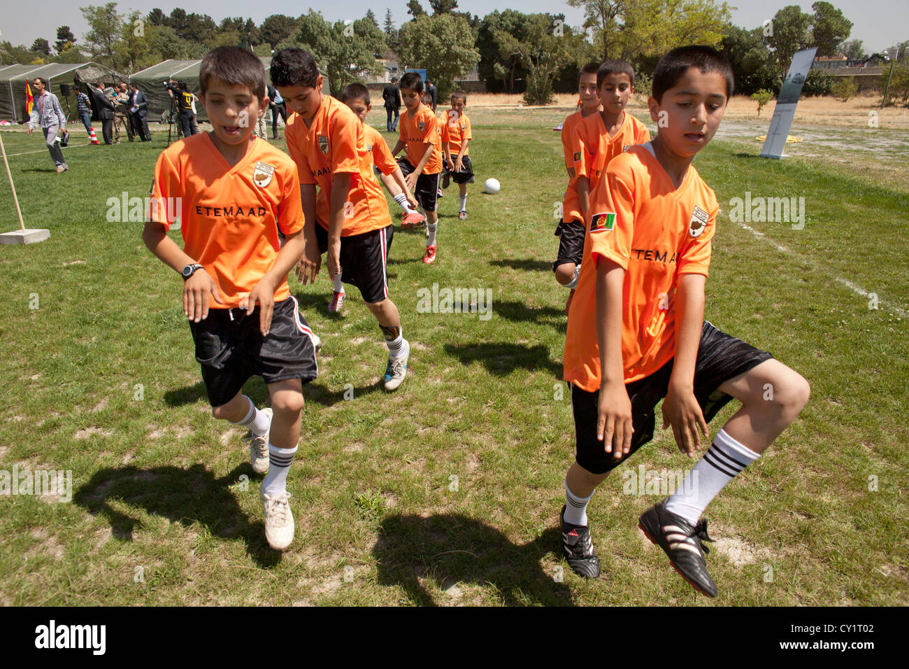Children playing football field hi-res stock photography and images - Alamy