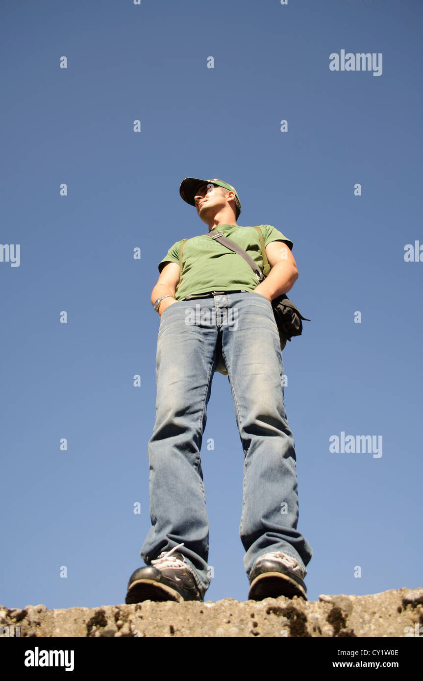 Young man standing Stock Photo - Alamy