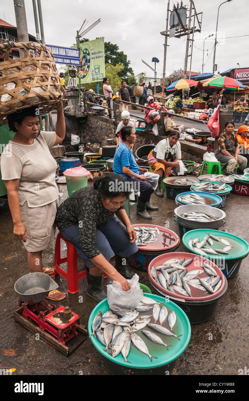 Woman selling fish, at the Pasar Badung market in Denpasar, Bali ...