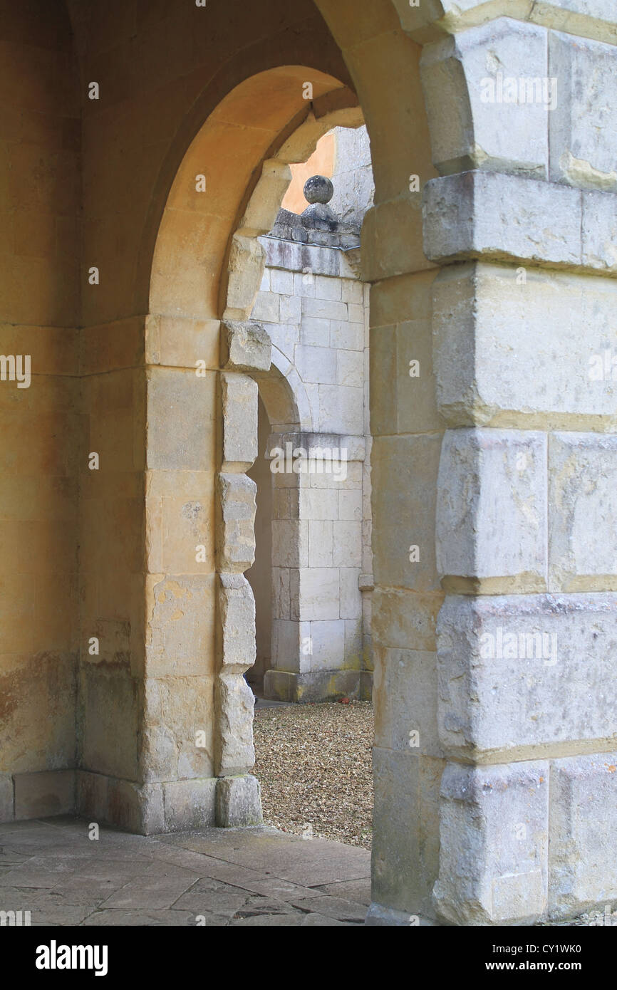 Architectural angles looking through limestone arches of garden folly ...