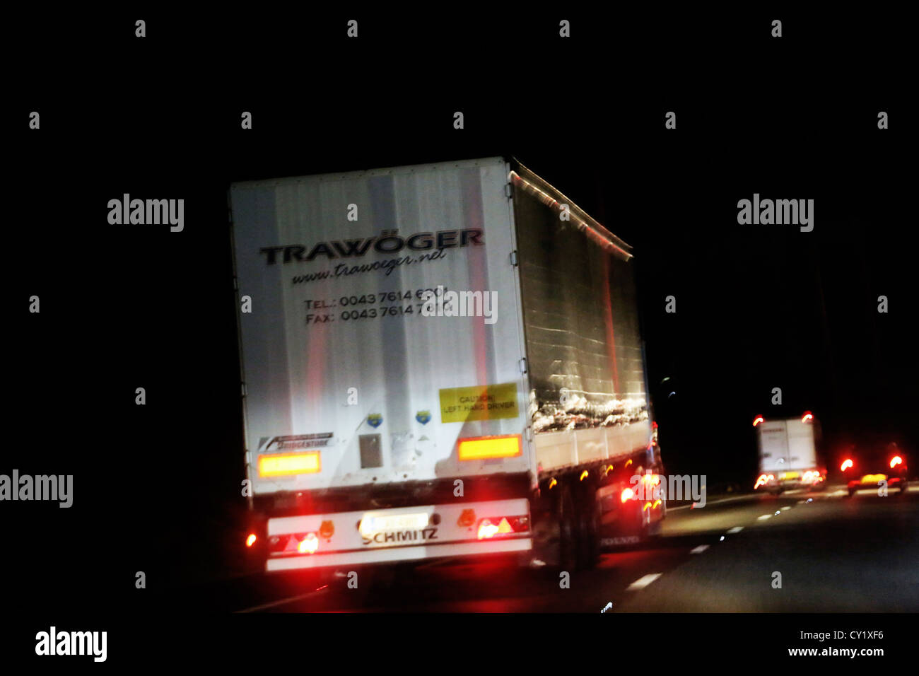Lorries On Motorway At Night England Stock Photo - Alamy