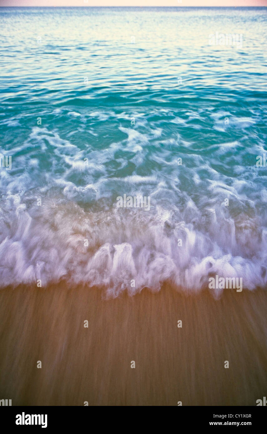 Waves come ashore in morning on Seven Mile Beach, Grand Cayman Stock ...