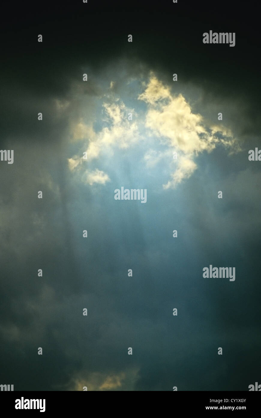 Shaft of sunlight breaking through storm clouds Stock Photo - Alamy