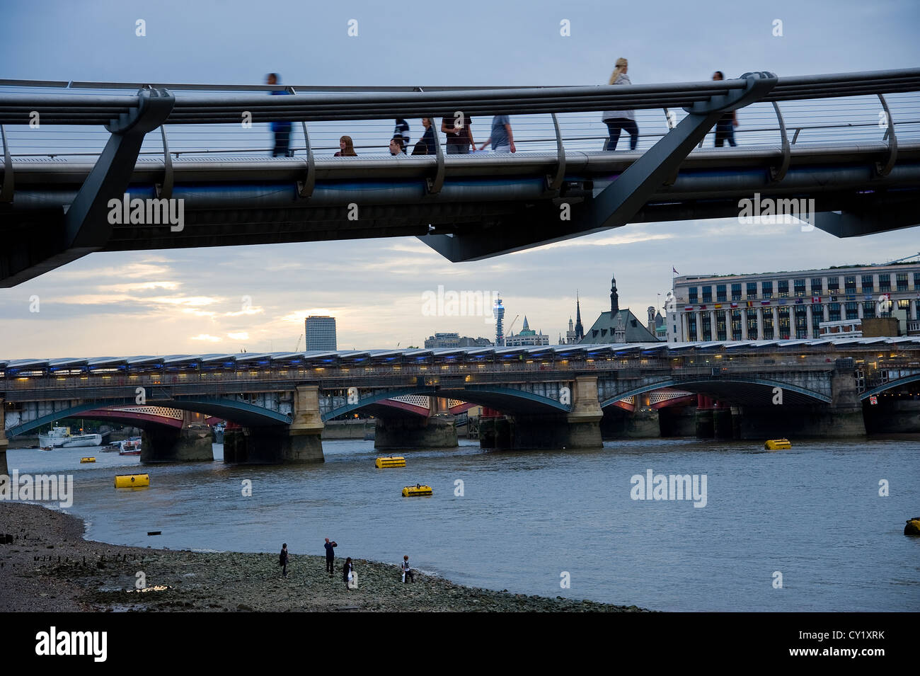 People crossing the Millennium Bridge and Waterloo Bridge Stock Photo ...