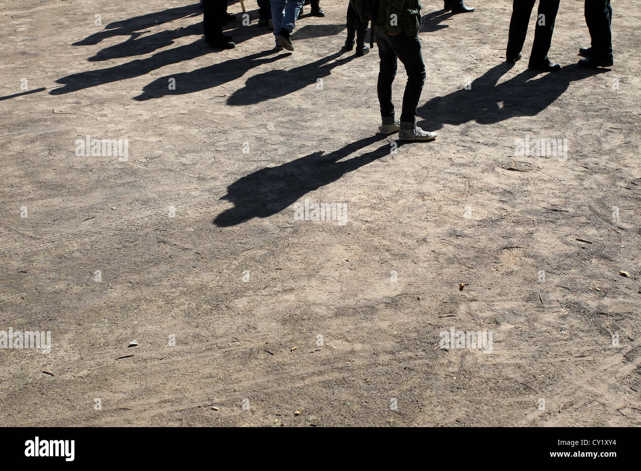 Shadows on the ground from people standing on The Level park in ...