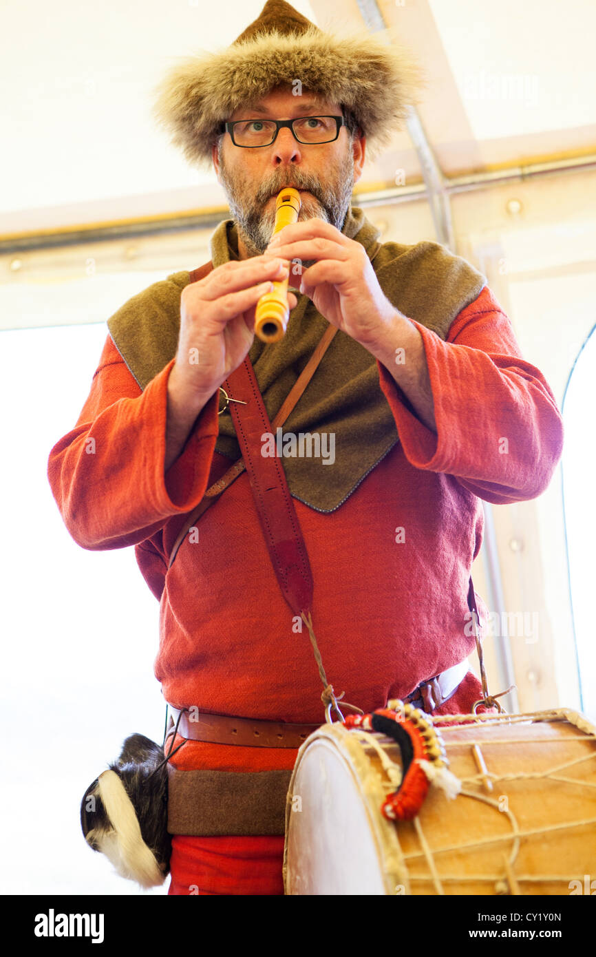 A musician plays during a gathering of an old Norse gods religious sect ...