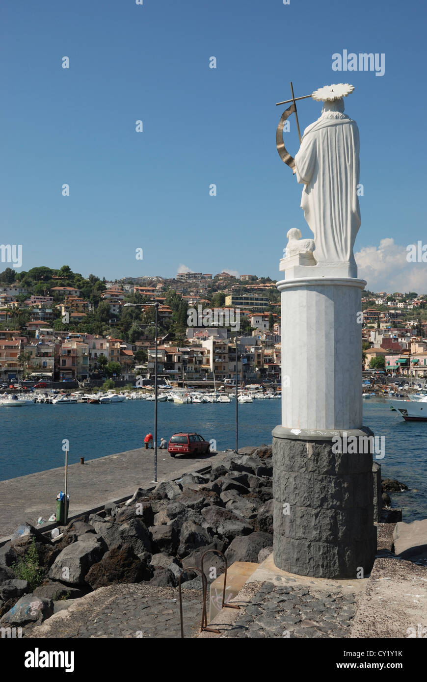 A statue overlooking the harbour at Aci Trezza, Sicily, Italy Stock ...