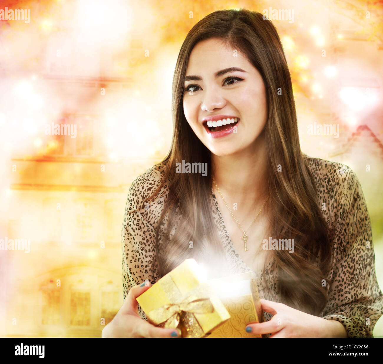 Happy Girl Opening a Gift Box Stock Photo - Alamy