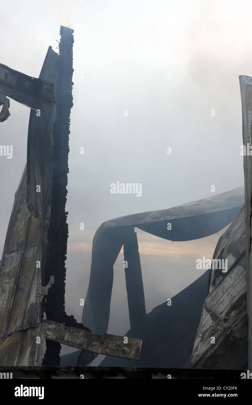 Rubble and metal frame left from a building that collapsed in a fire ...