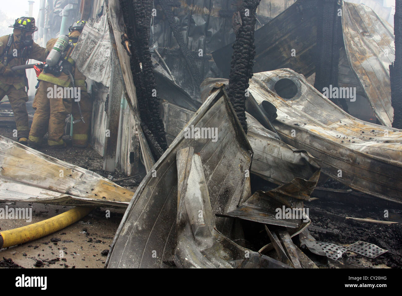 Firefighters at the scene of a collapsed building Stock Photo - Alamy