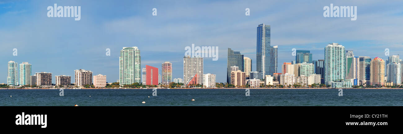 Miami skyline panorama in the day with urban skyscrapers and cloudy sky ...