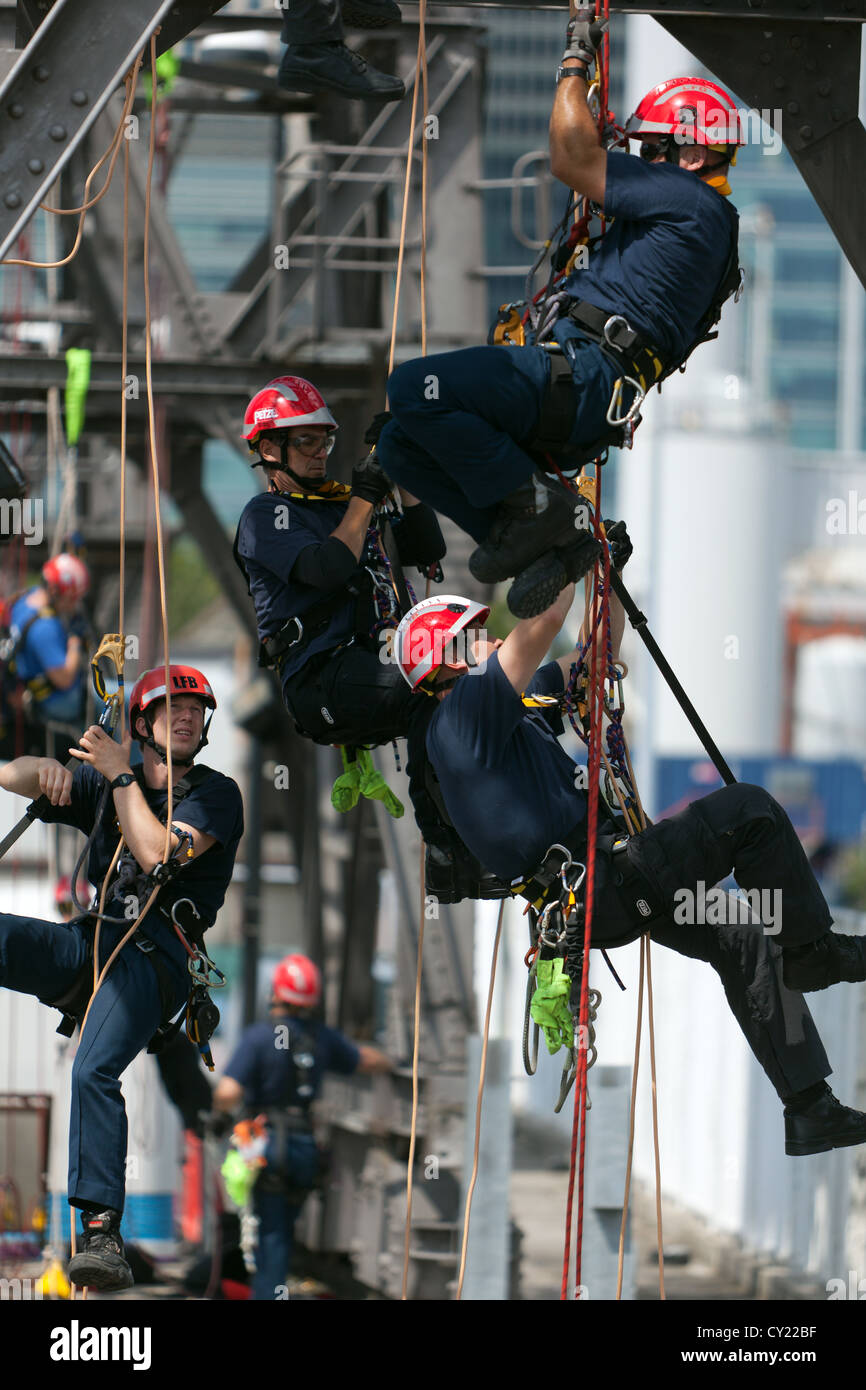 Members of London Fire Brigade practise rope rescue procedures on old ...
