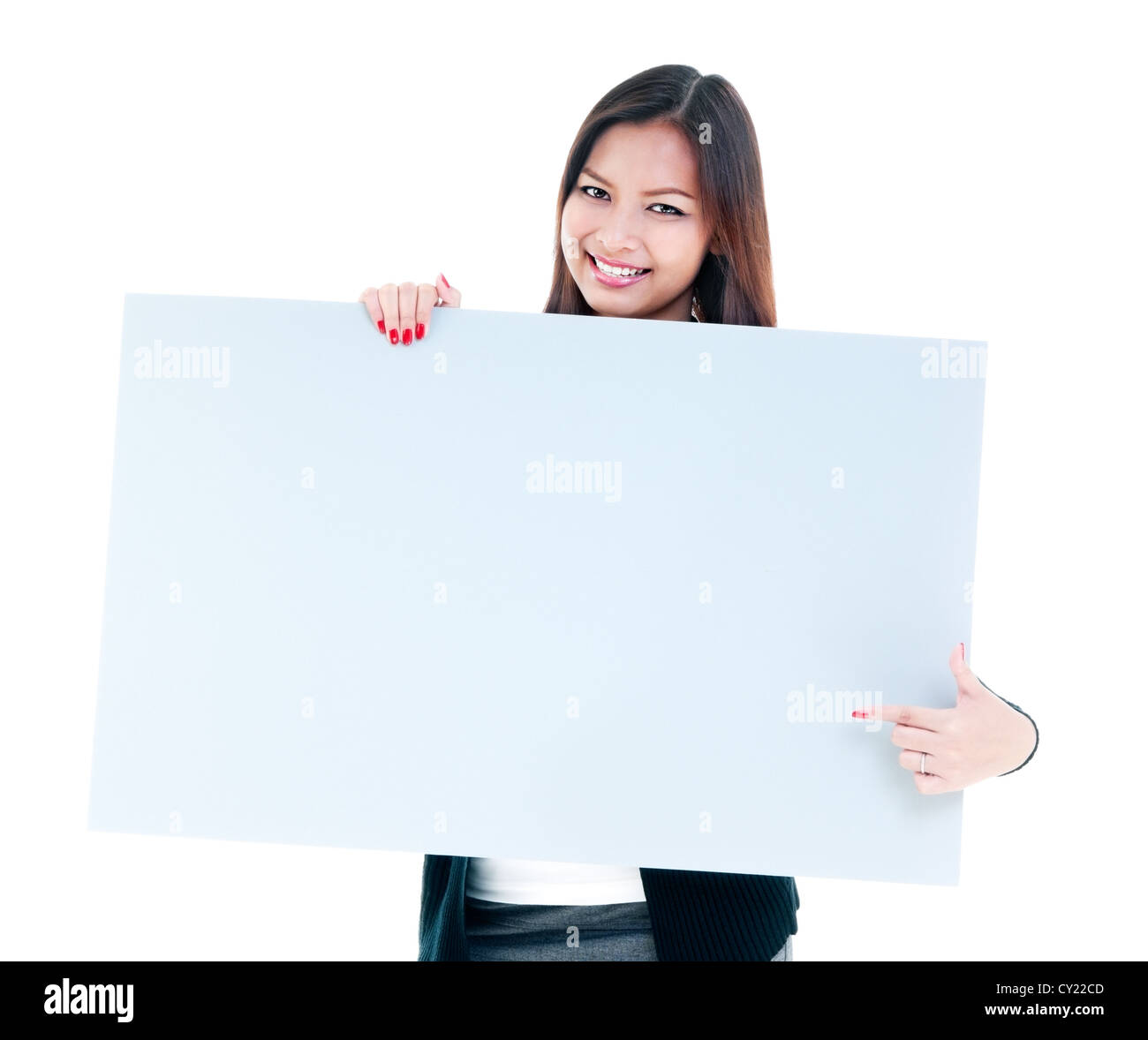 Happy young woman pointing at blank signboard, portrait Stock Photo - Alamy