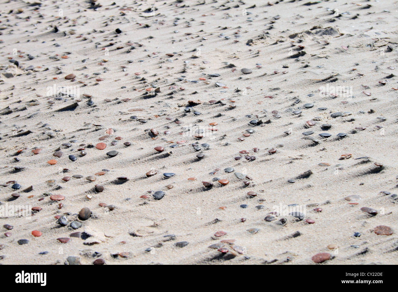 Sand and stone pattern on the beach Stock Photo - Alamy