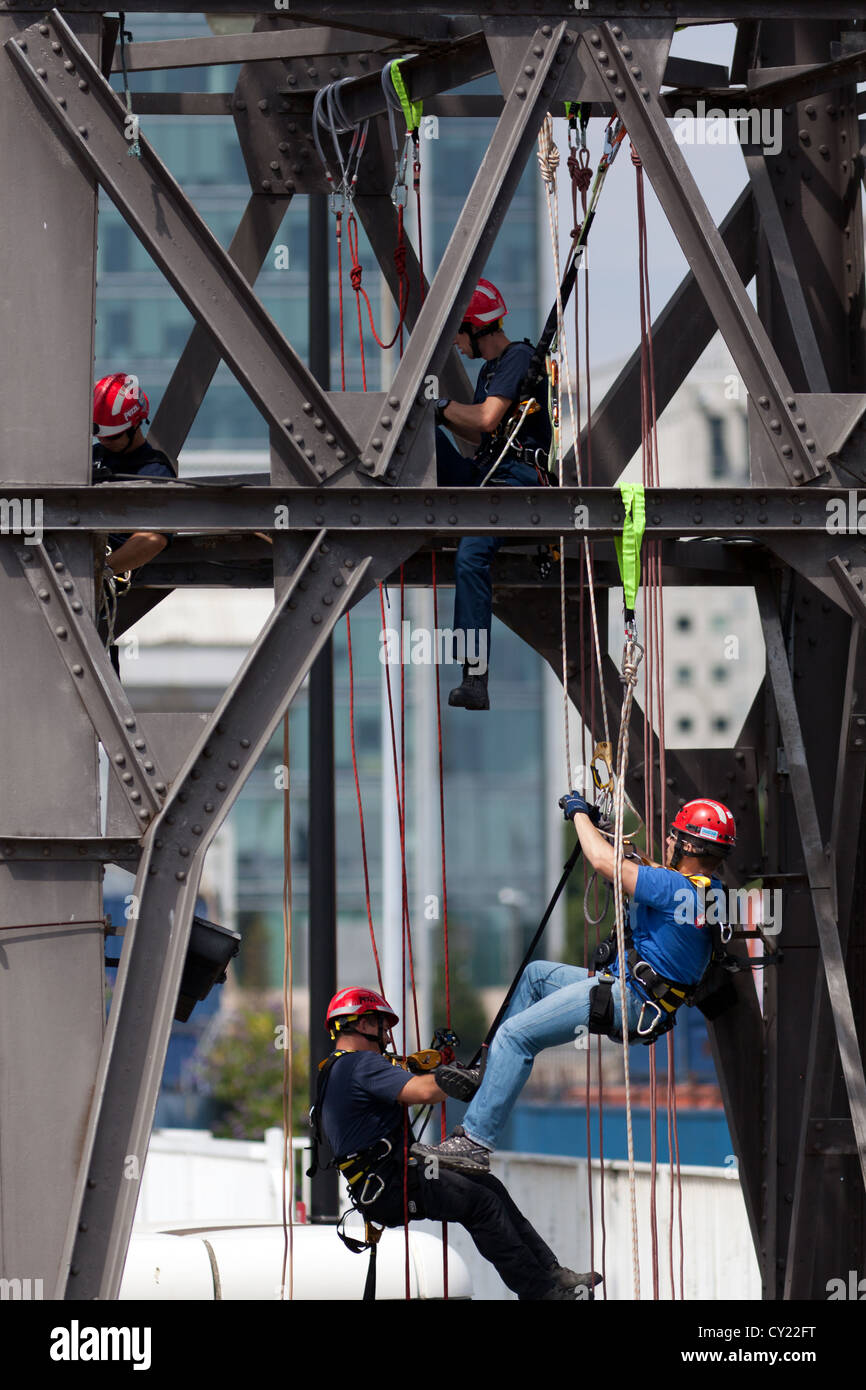 Members of London Fire Brigade practise rope rescue procedures on old ...
