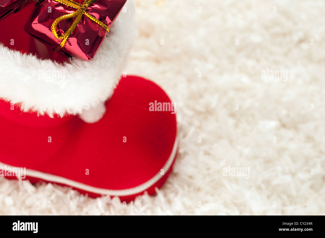 red christmas boot with gifts on white background with copytext Stock ...
