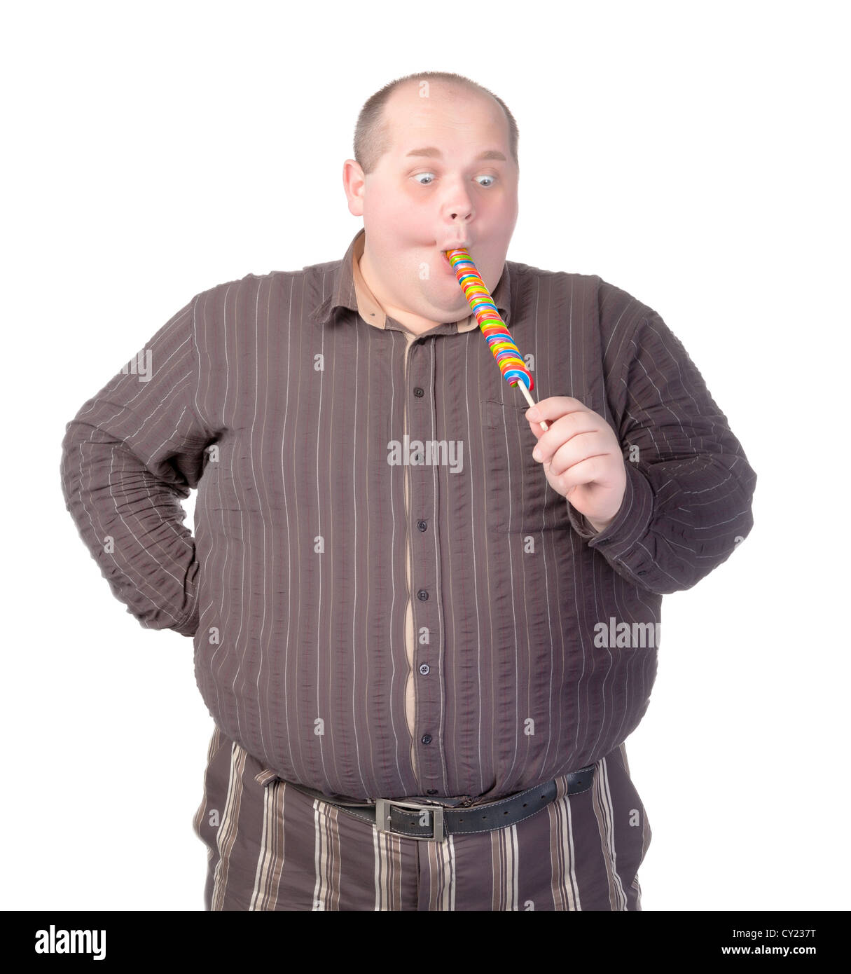 Fat obese man enjoying a a long colourful striped lollipop Stock Photo ...