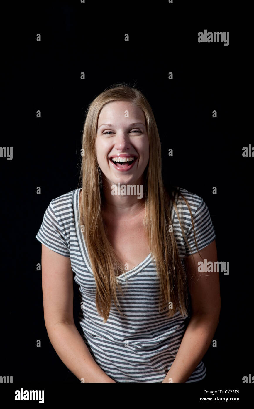 Pretty white woman with long blond hair, laughing at the camera Stock ...