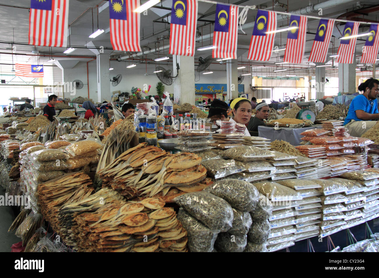 Dried fish seller at the Central Market, Sandakan waterfront, Sabah ...