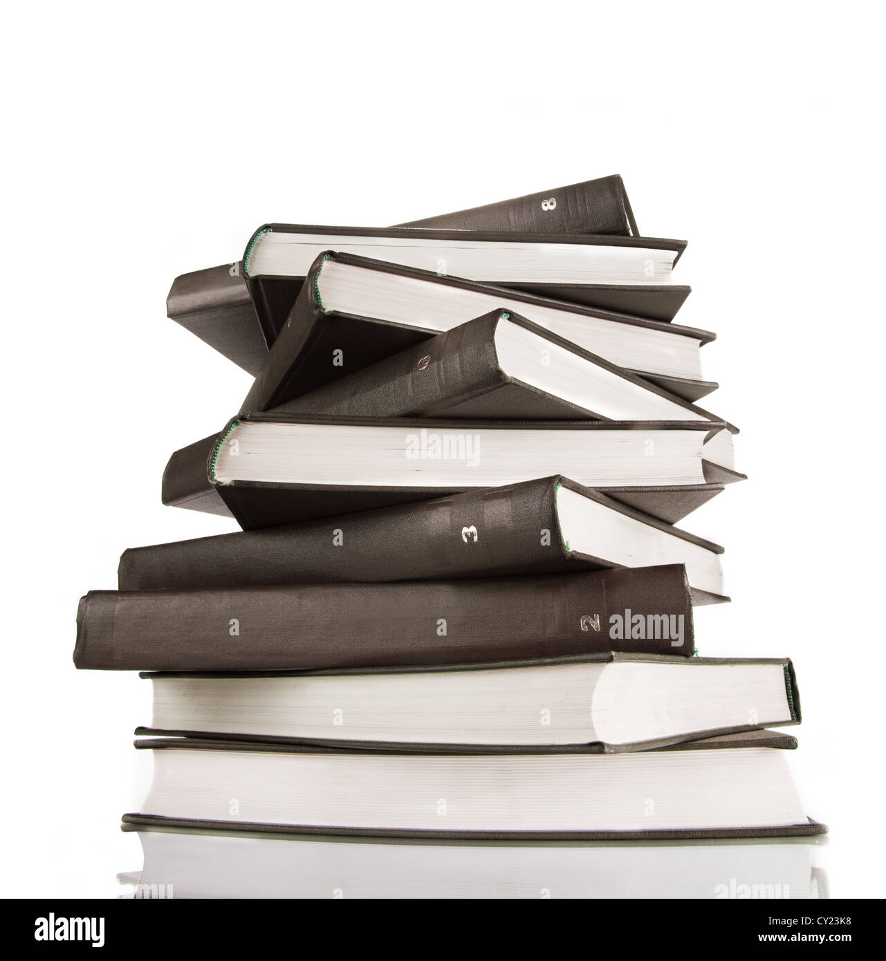 Stacked books, low angle view, isolated on white background Stock Photo ...