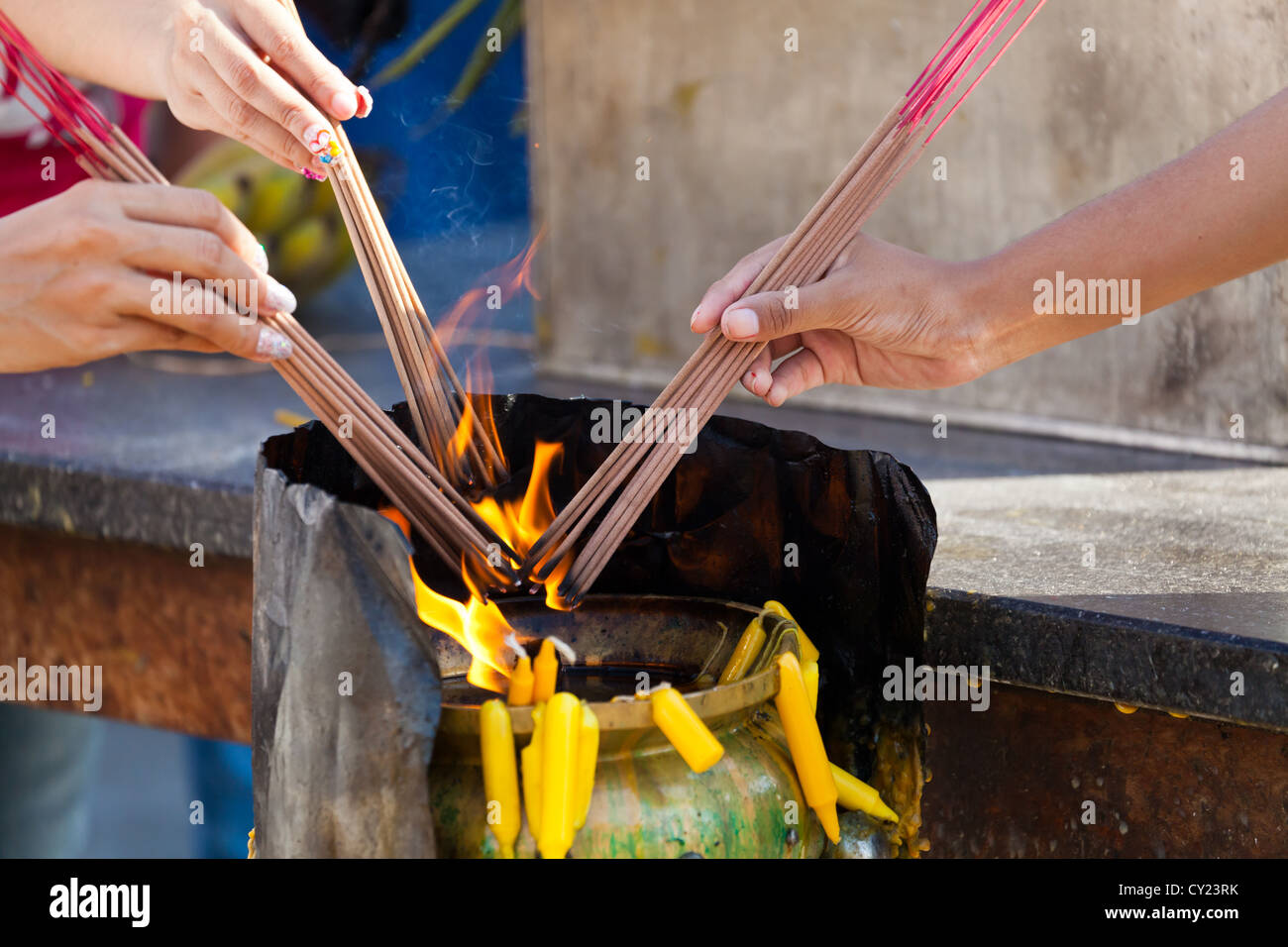 Lighting Incense Sticks in Phnom Penh, Cambodia Stock Photo - Alamy