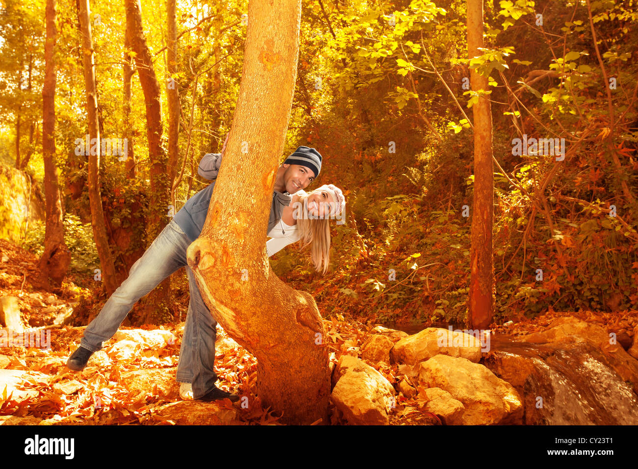 Picture of cute young family having fun in fall forest, boyfriend and ...