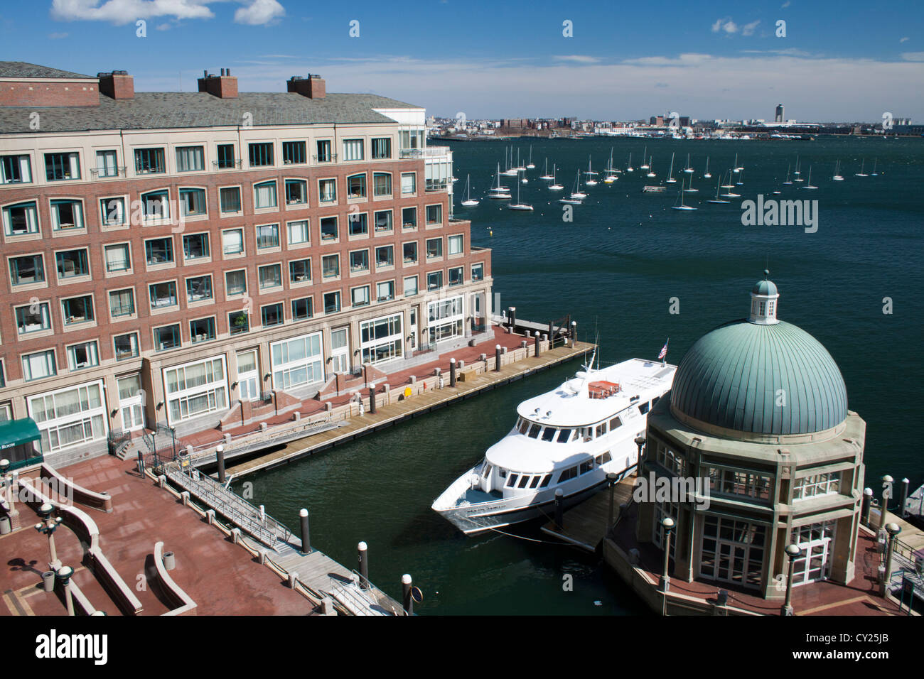 Boston Harbor Walk view from above Rose Wharf with Boston Logan Airport ...