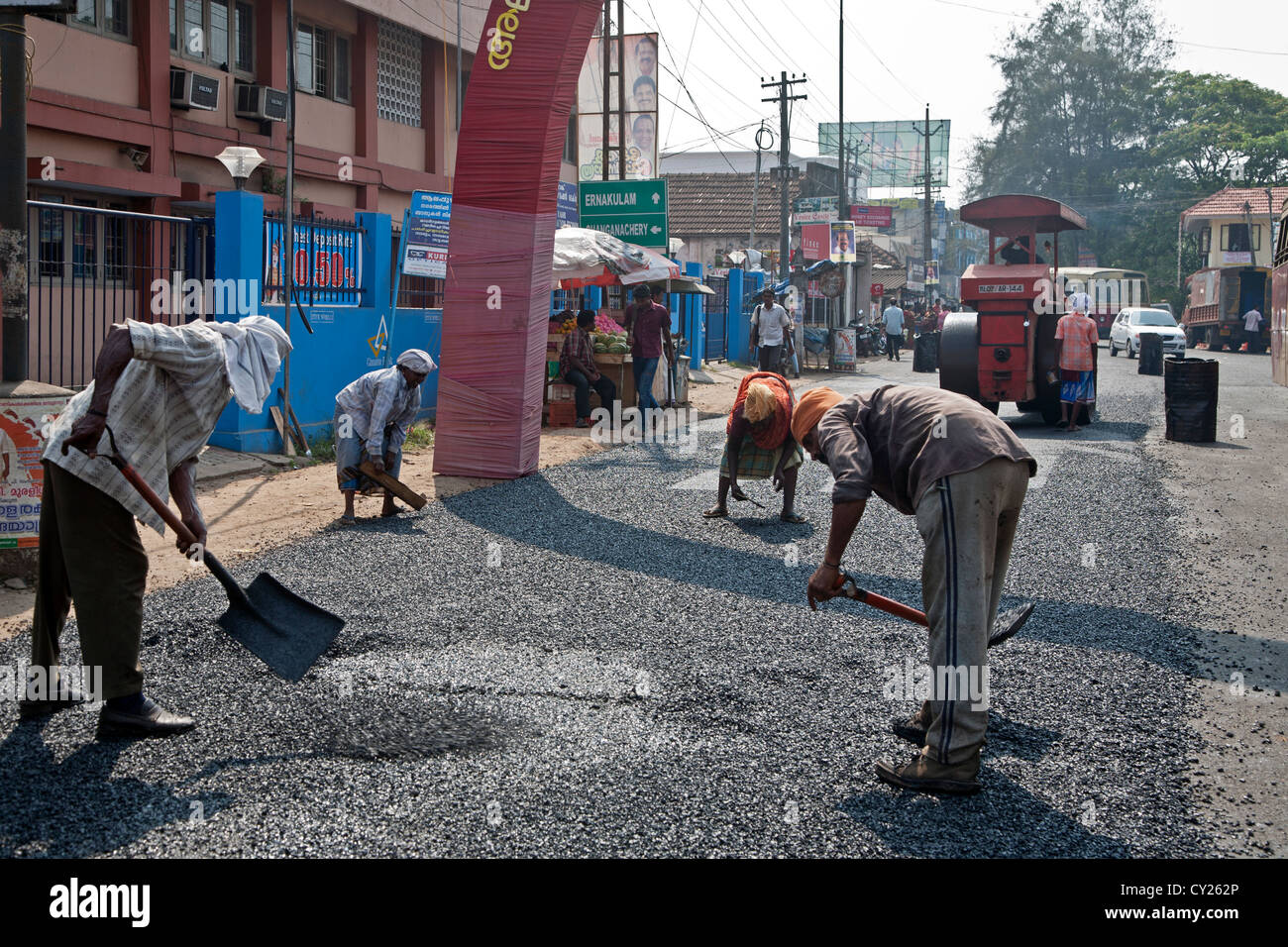 Men paving a road. New Delhi. India Stock Photo - Alamy