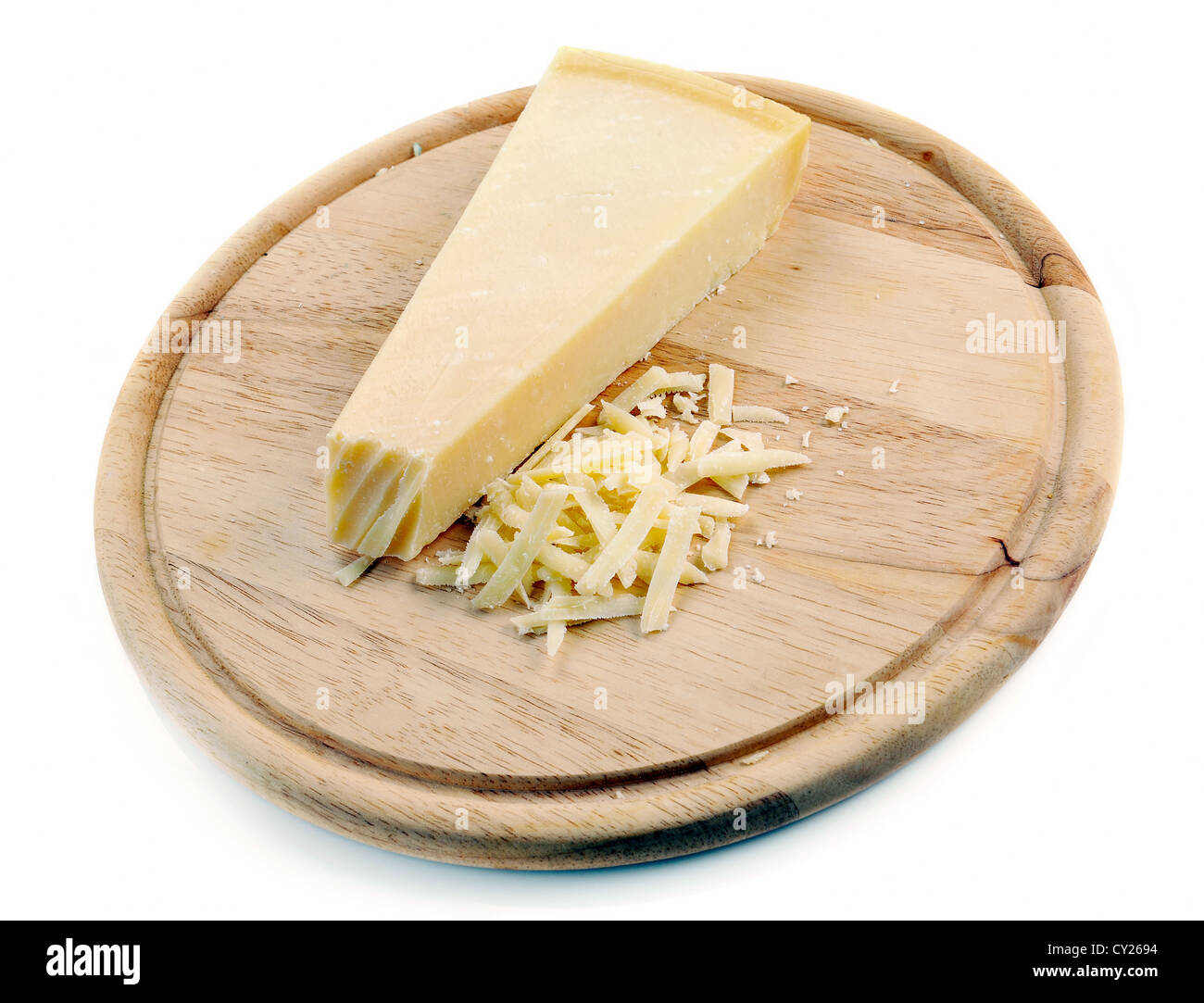 lock of parmesan cheese on wooden cutting board Stock Photo - Alamy