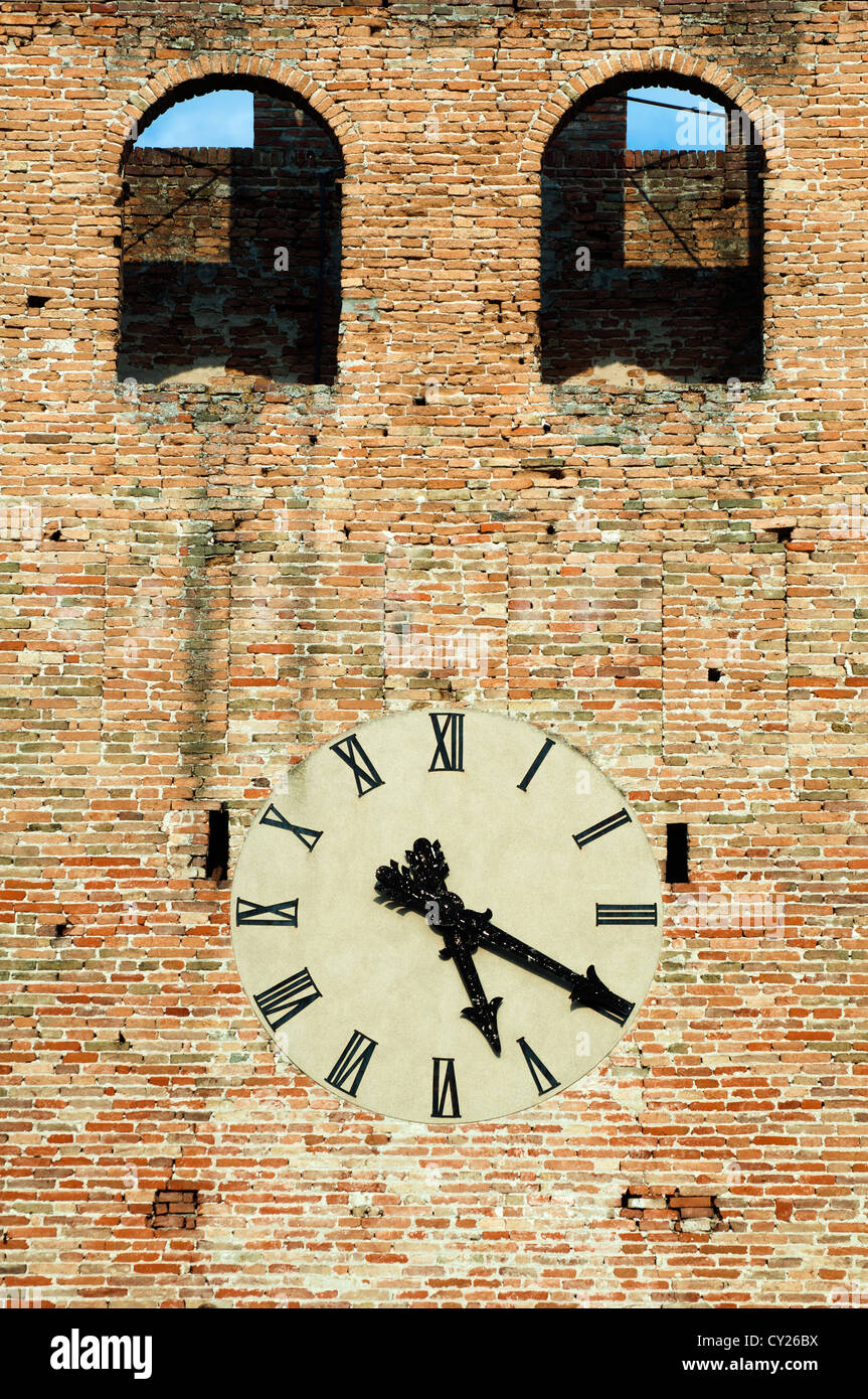 Antique clock on a building. Ancient brick wall Stock Photo - Alamy