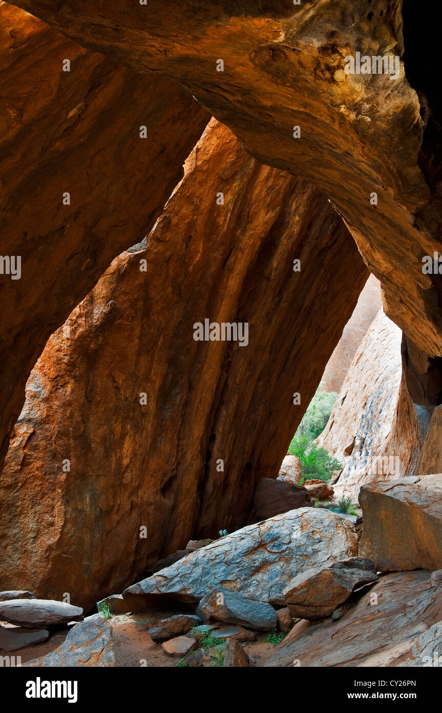 Cave at the western side of amazing Uluru Stock Photo - Alamy