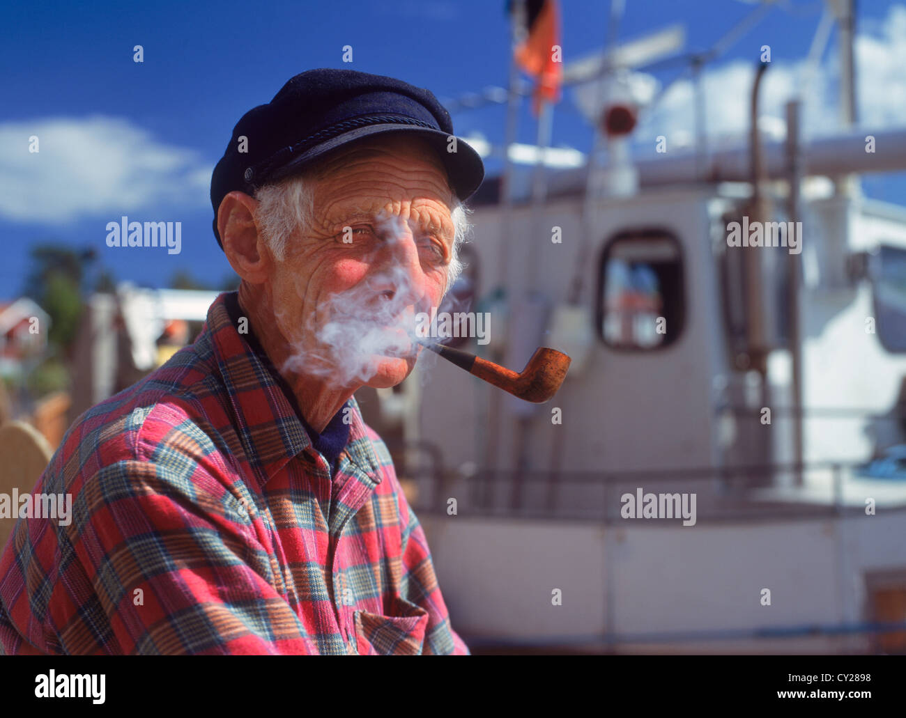Pipe smoking fisherman hi-res stock photography and images - Alamy