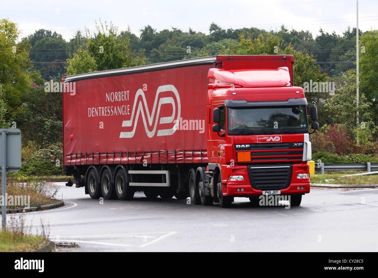 A Norbert Dentressangle truck traveling around a roundabout in England ...