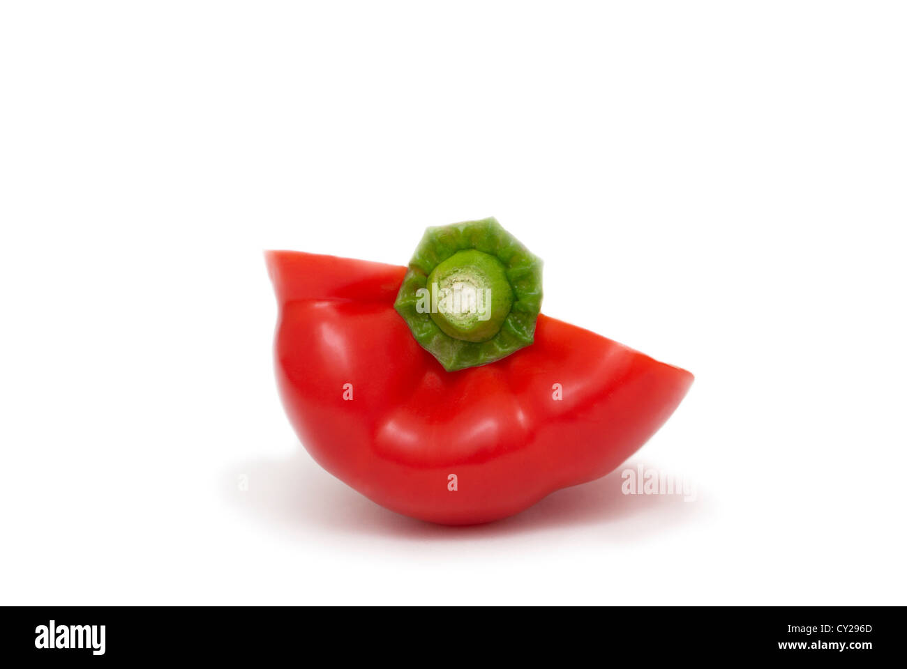 Half of red pepper on a white background Stock Photo - Alamy