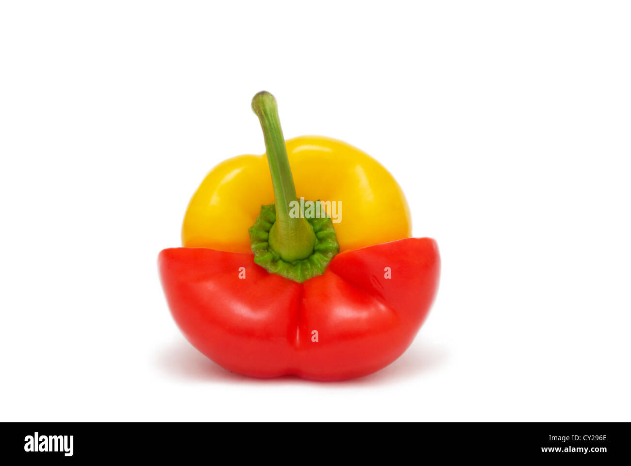 Red and yellow pepper on white background Stock Photo - Alamy