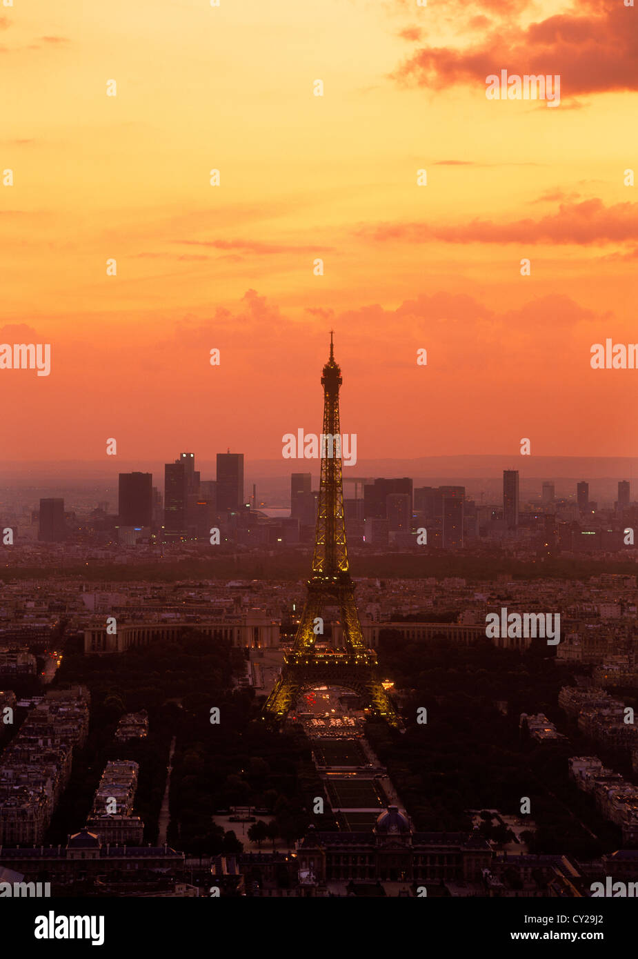 Streets and apartment buildings below Eiffel Tower in Paris at sunset ...
